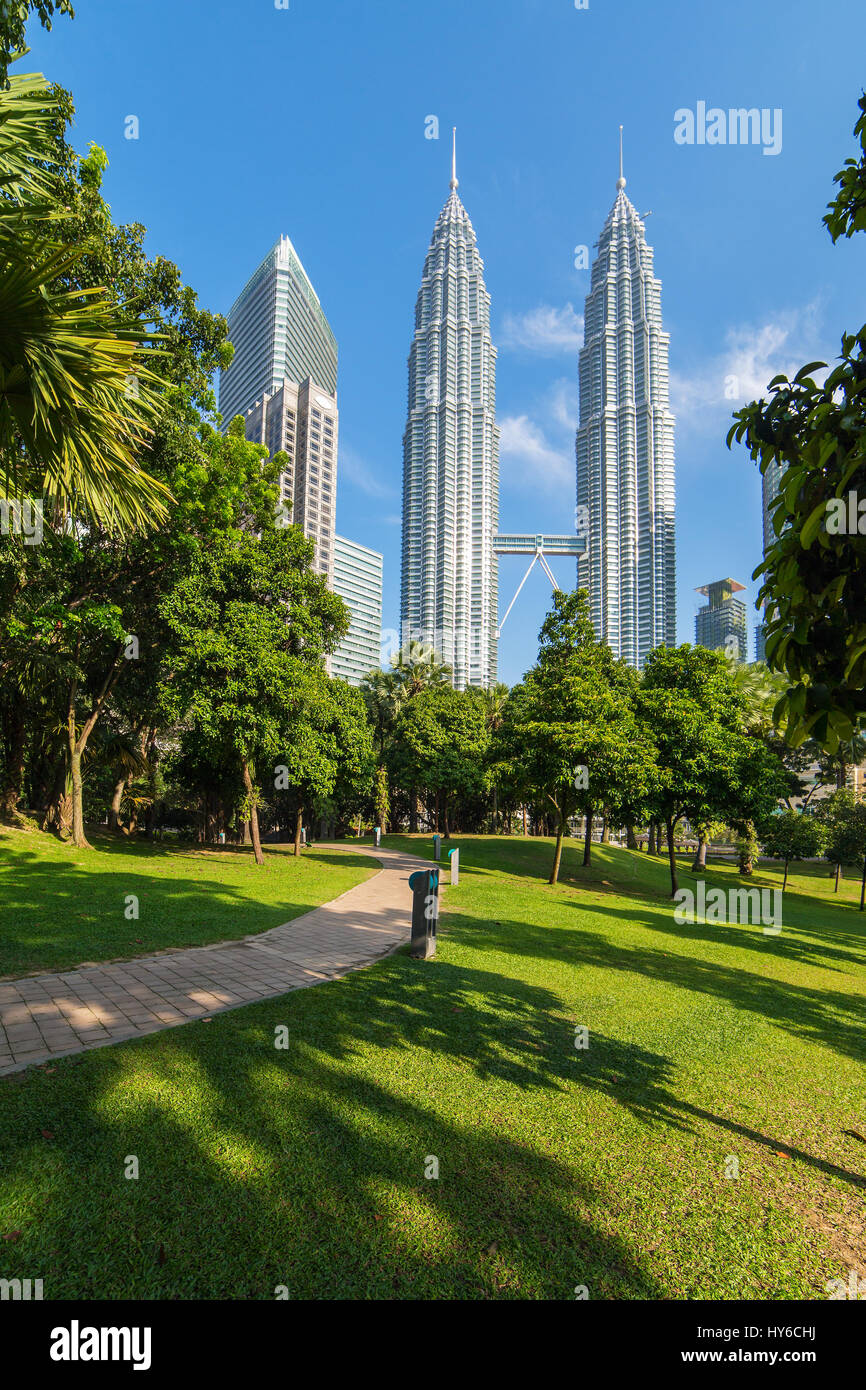 Petronas towers and green park in Kuala Lumpur, Malaysia Stock Photo ...