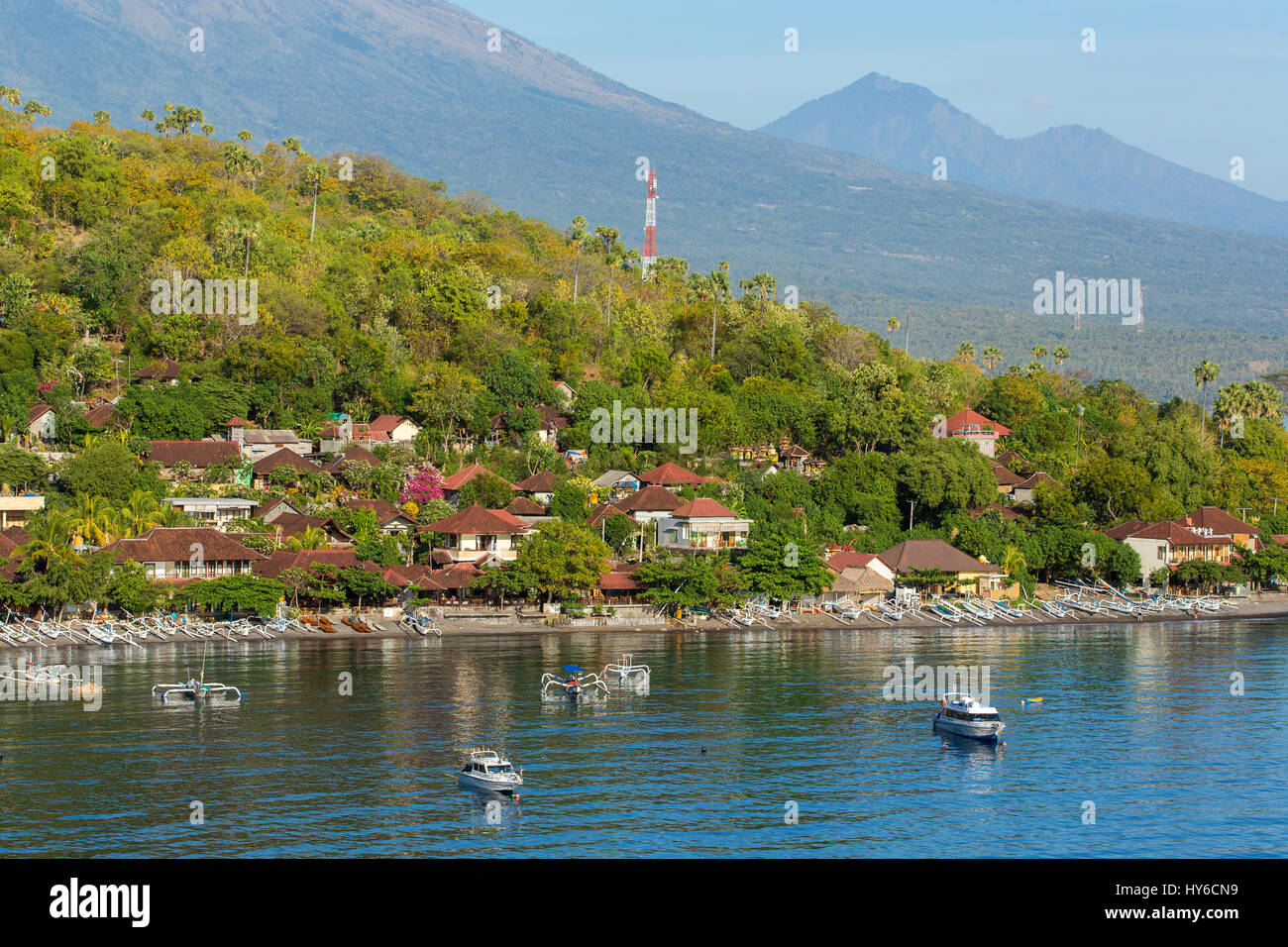 Jemeluk Beach and beautiful blue lagoon with Gunung Agung volcano on ...