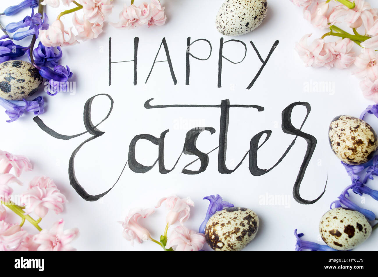 Handwritten Happy Easter note on white paper Stock Photo - Alamy