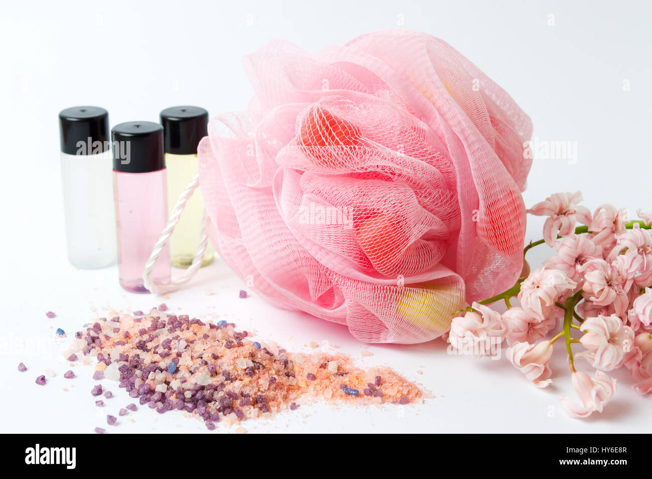 Bath sponge and salt with pink flowers and essential oils Stock Photo ...