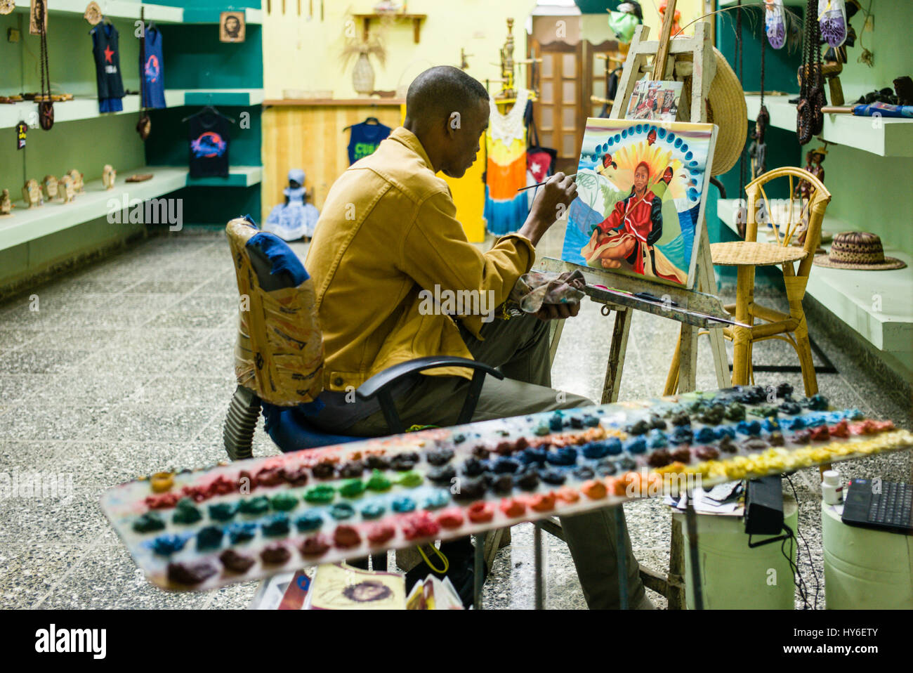 A Cuban artist painting in his gallery in old Havana, Cuba Stock Photo ...