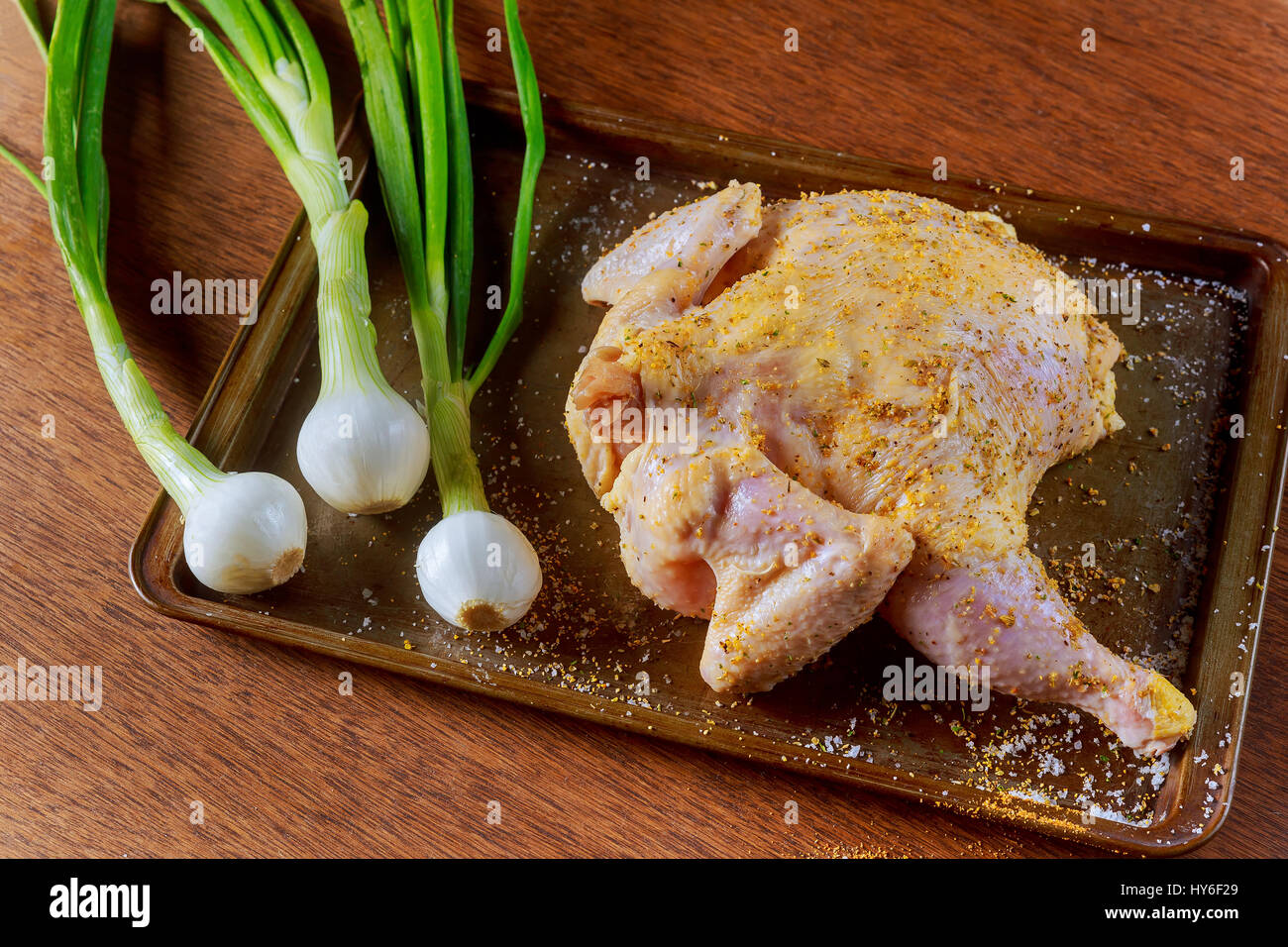 tasty and juicy marinated chicken on a chopping board marinated whole ...