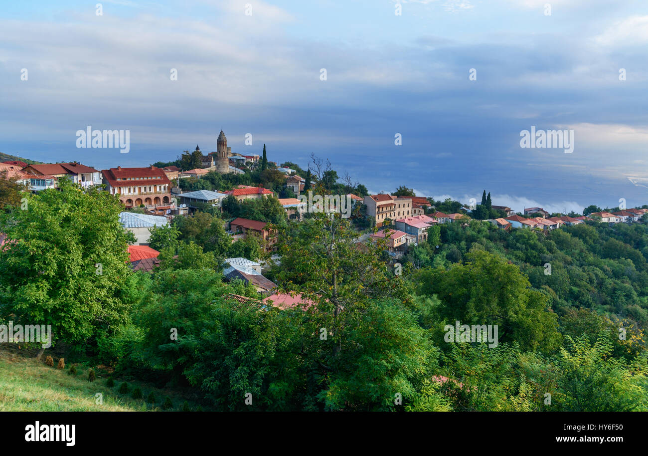 View of houses and old church in Signagi or Sighnaghi city in mountains ...