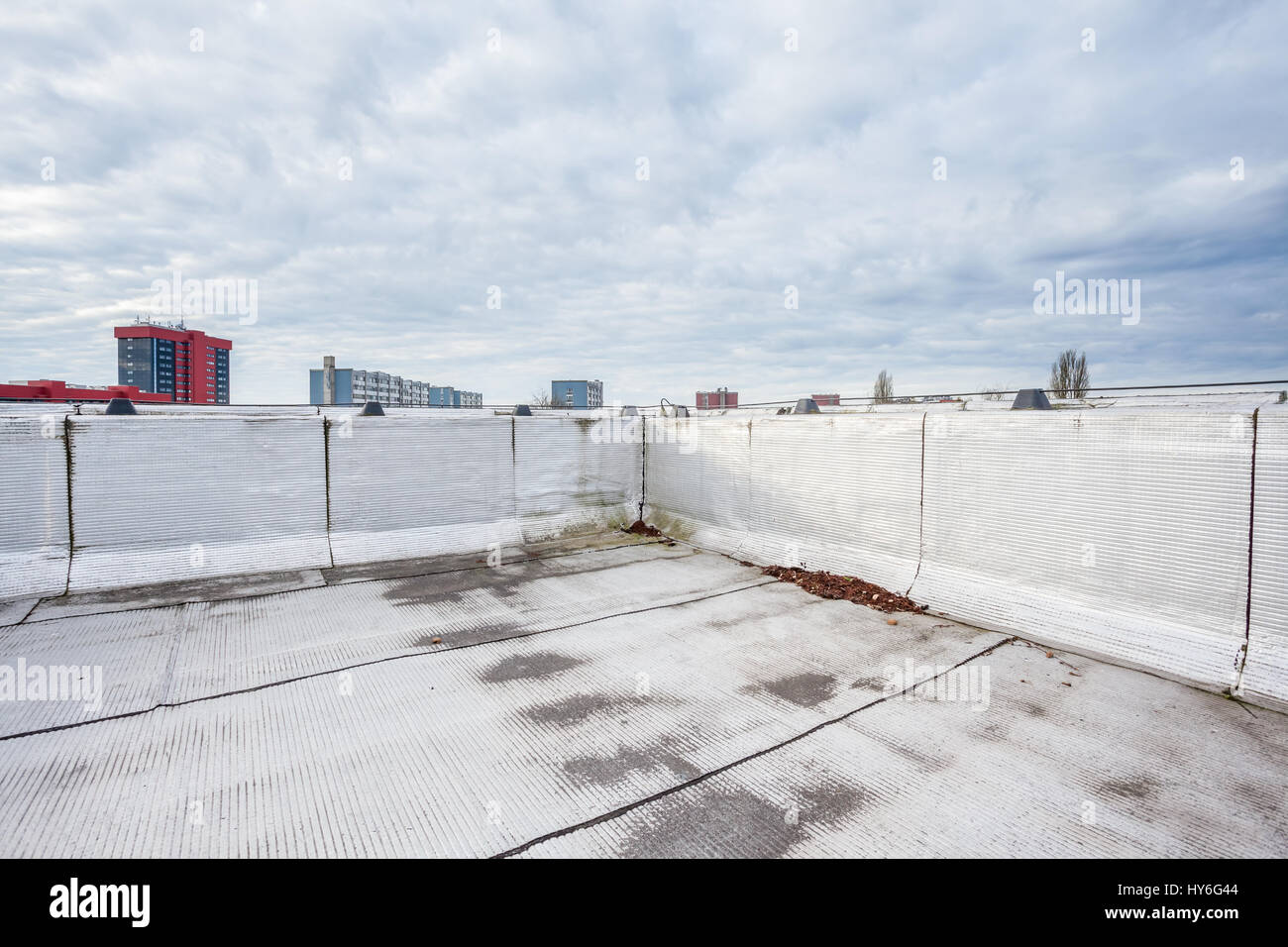 an flat roof with roofing and fencing Stock Photo - Alamy