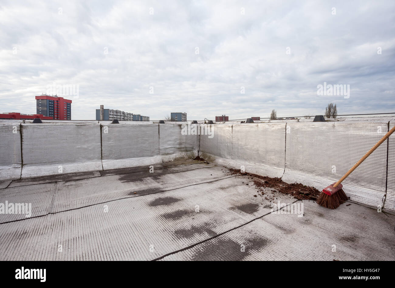 an flat roof with roofing and fencing Stock Photo - Alamy