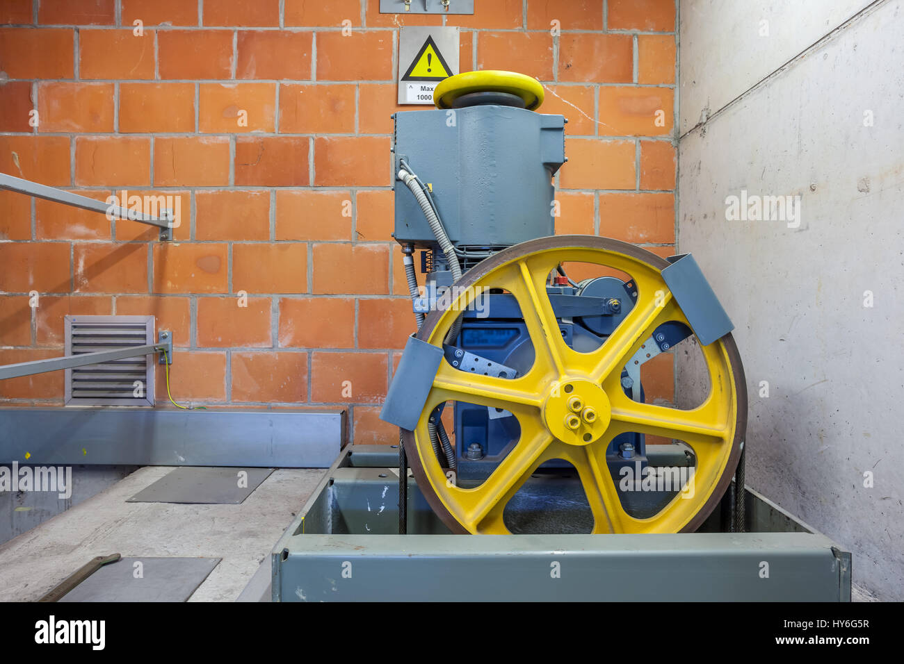 iron cables on a wheel of a motor of the elevator Stock Photo - Alamy