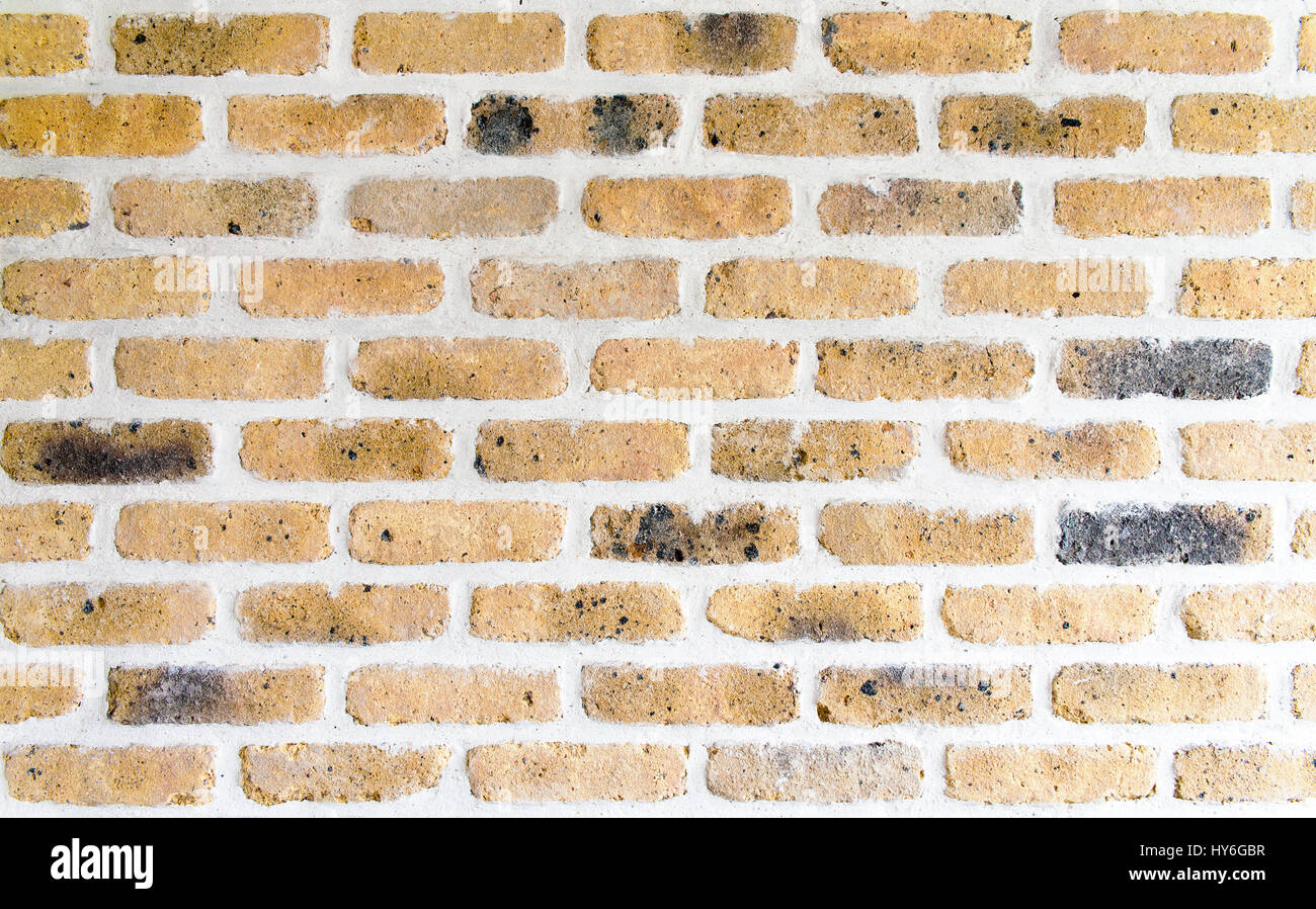 Yellow old dirty brick wall high definition picture Stock Photo - Alamy