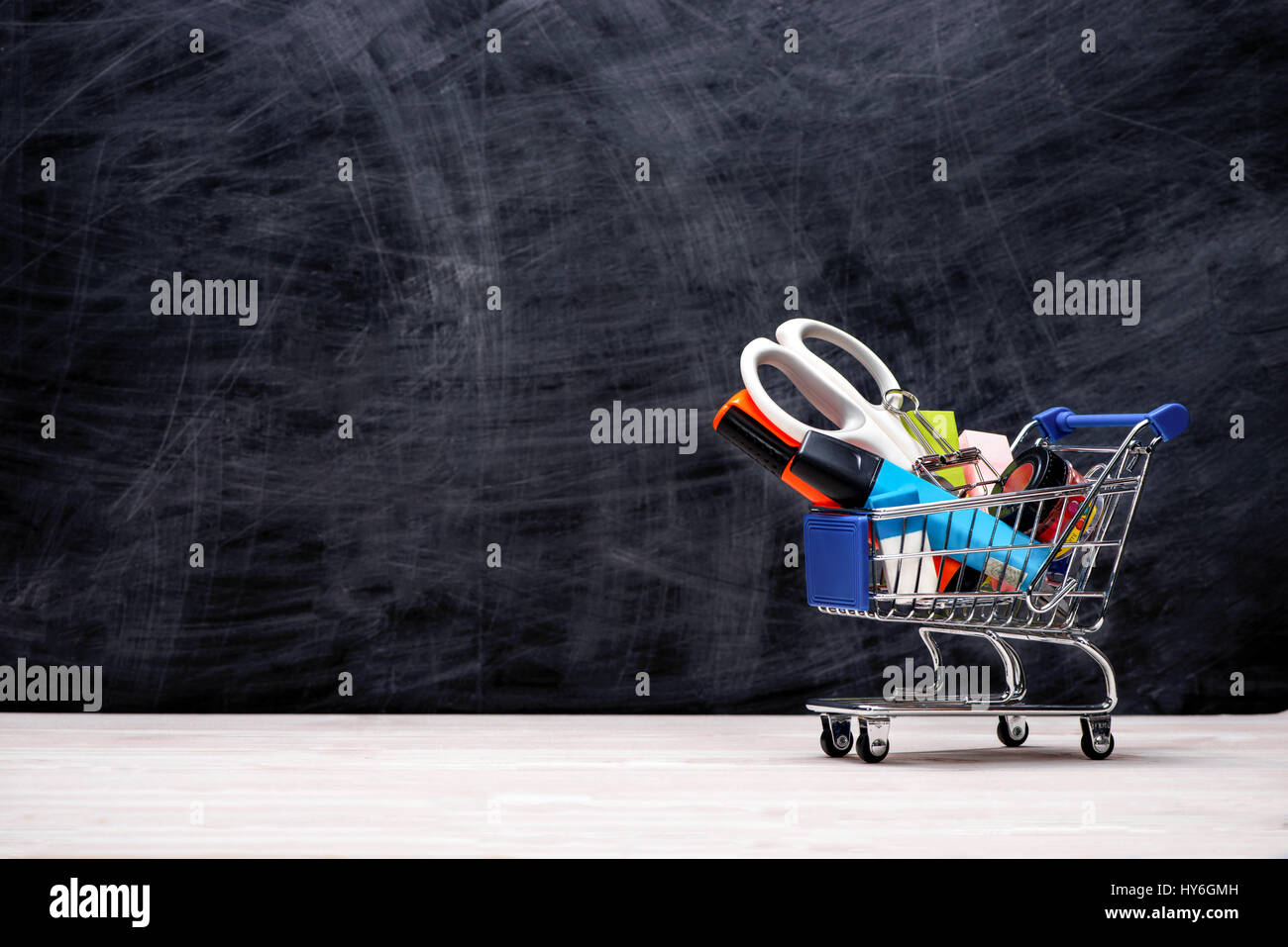 Education, Back to School, Shopping. Shopping cart with school supplies ...