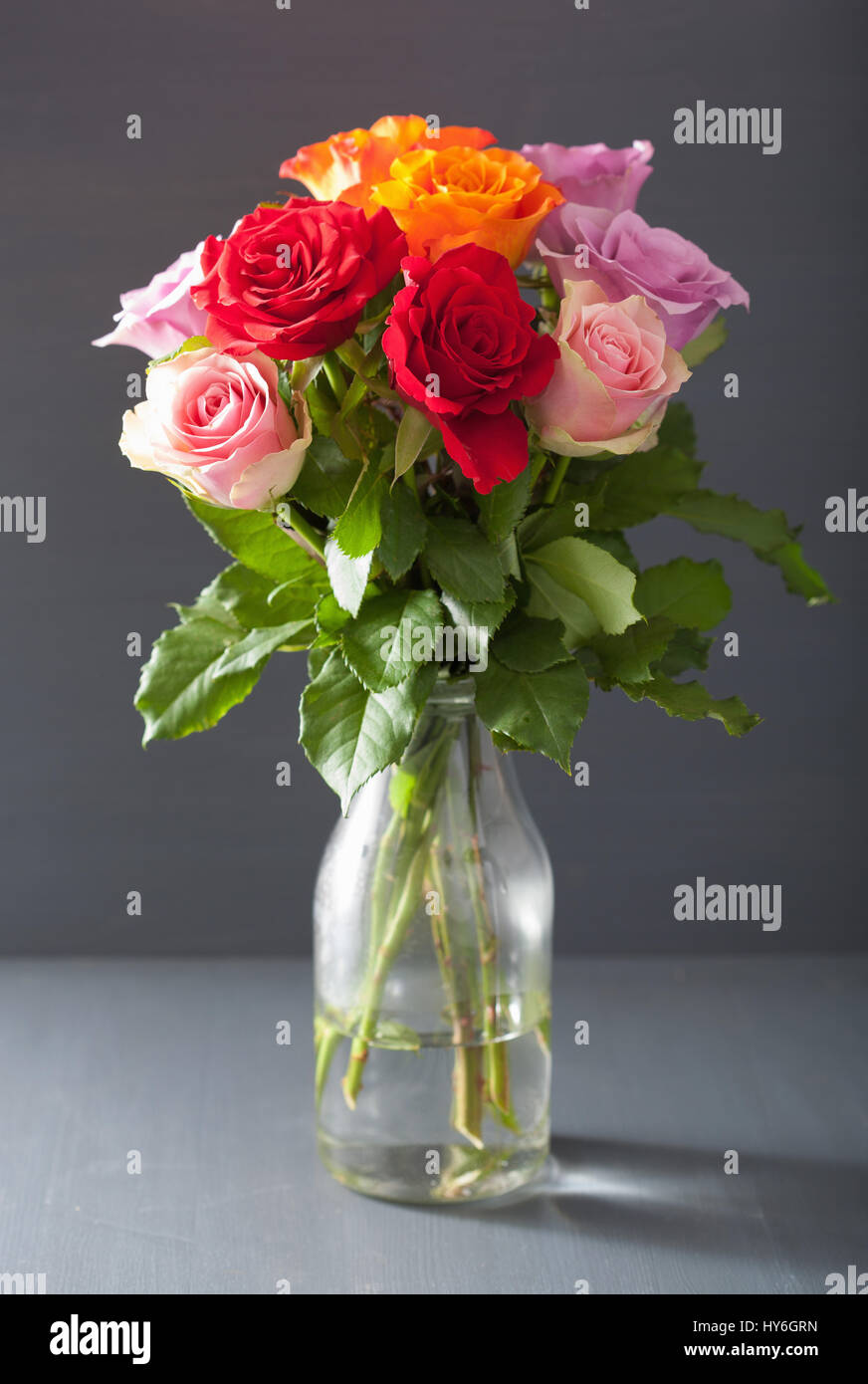 beautiful colorful rose flowers bouquet in vase Stock Photo - Alamy