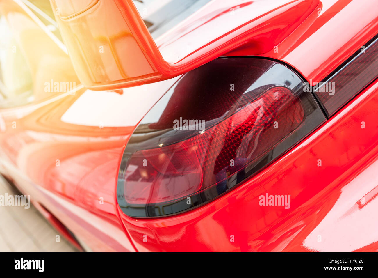 Back of a red car in the sunlight Stock Photo - Alamy