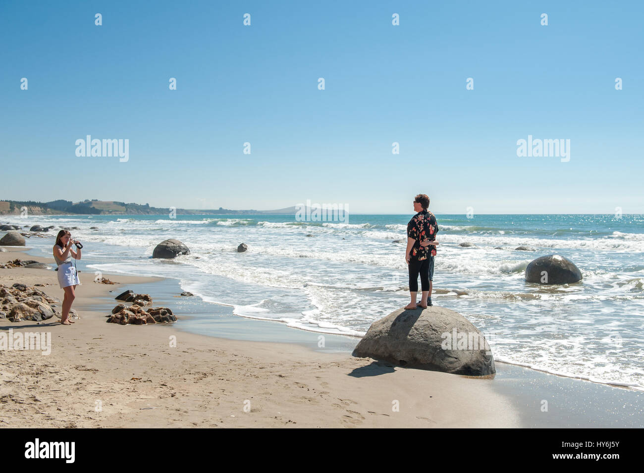 Moeraki boulders are a popular tourist attraction consisting of a group ...