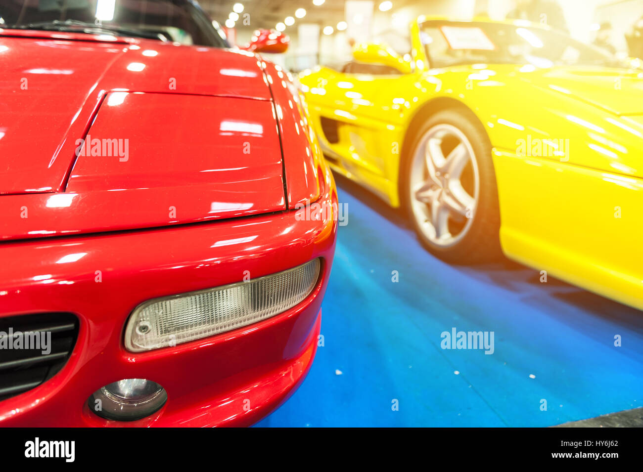Red and yellow generic sport cars in the sunlight Stock Photo - Alamy