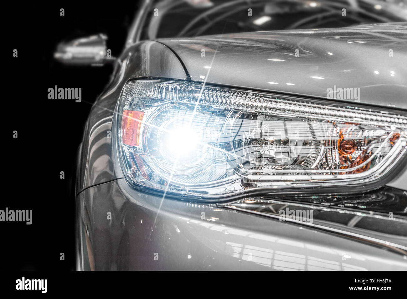 Modern grey car on a black background with light Stock Photo - Alamy