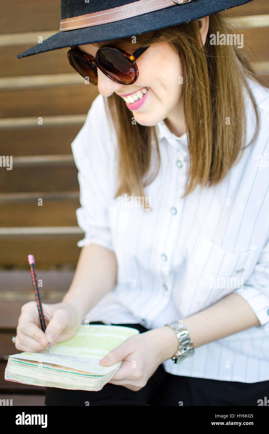 Girl with pencil and journal hi-res stock photography and images - Alamy