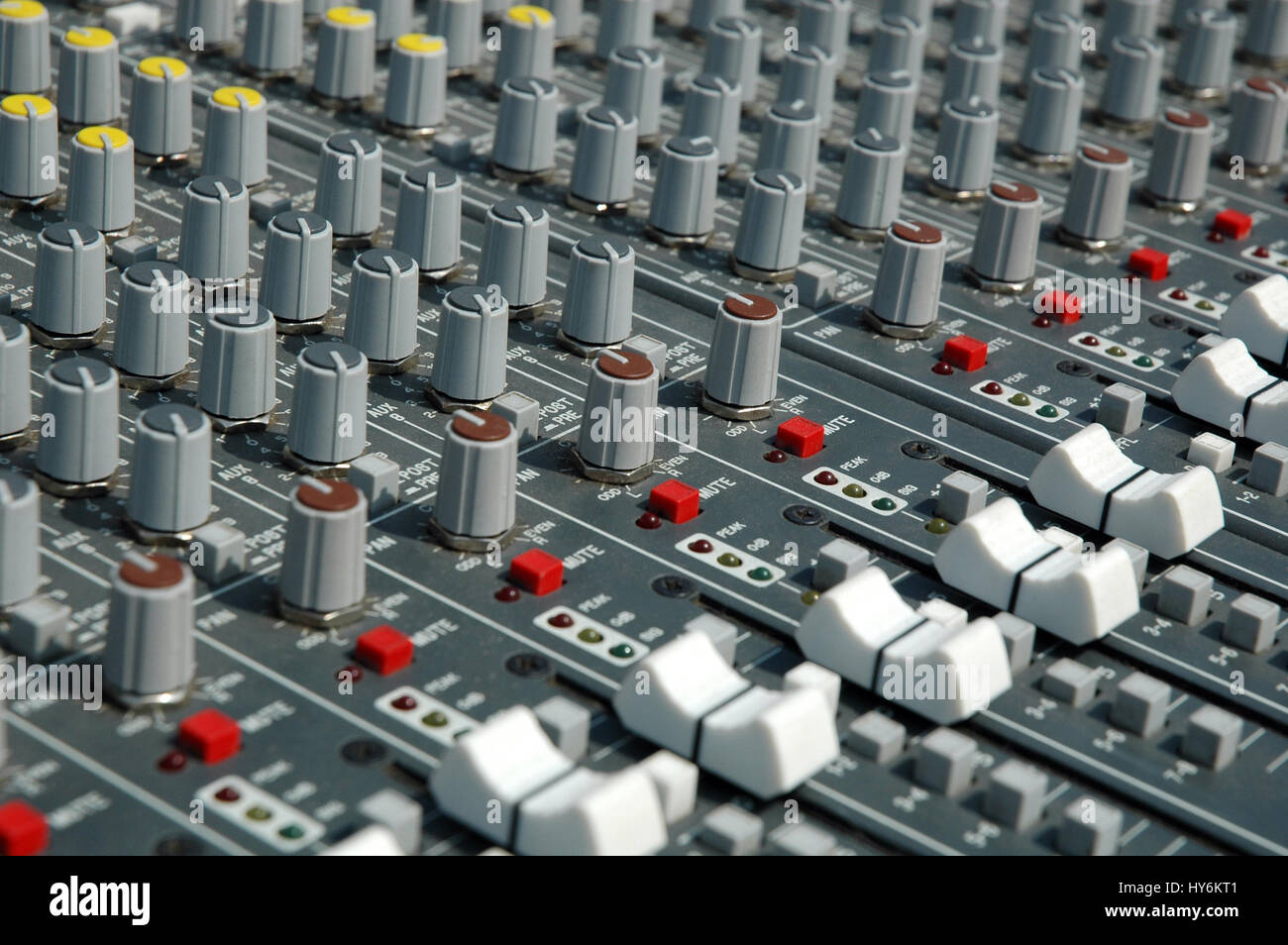 Audio mixing console in a recording studio. Faders and knobs of a sound ...