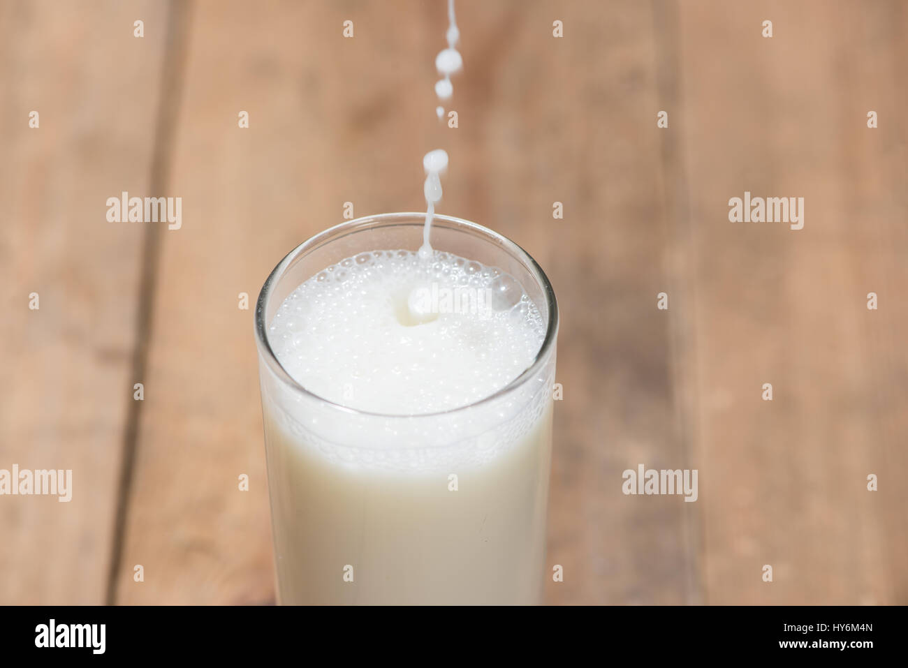 Milk. Image of Milk fall into glass Stock Photo - Alamy