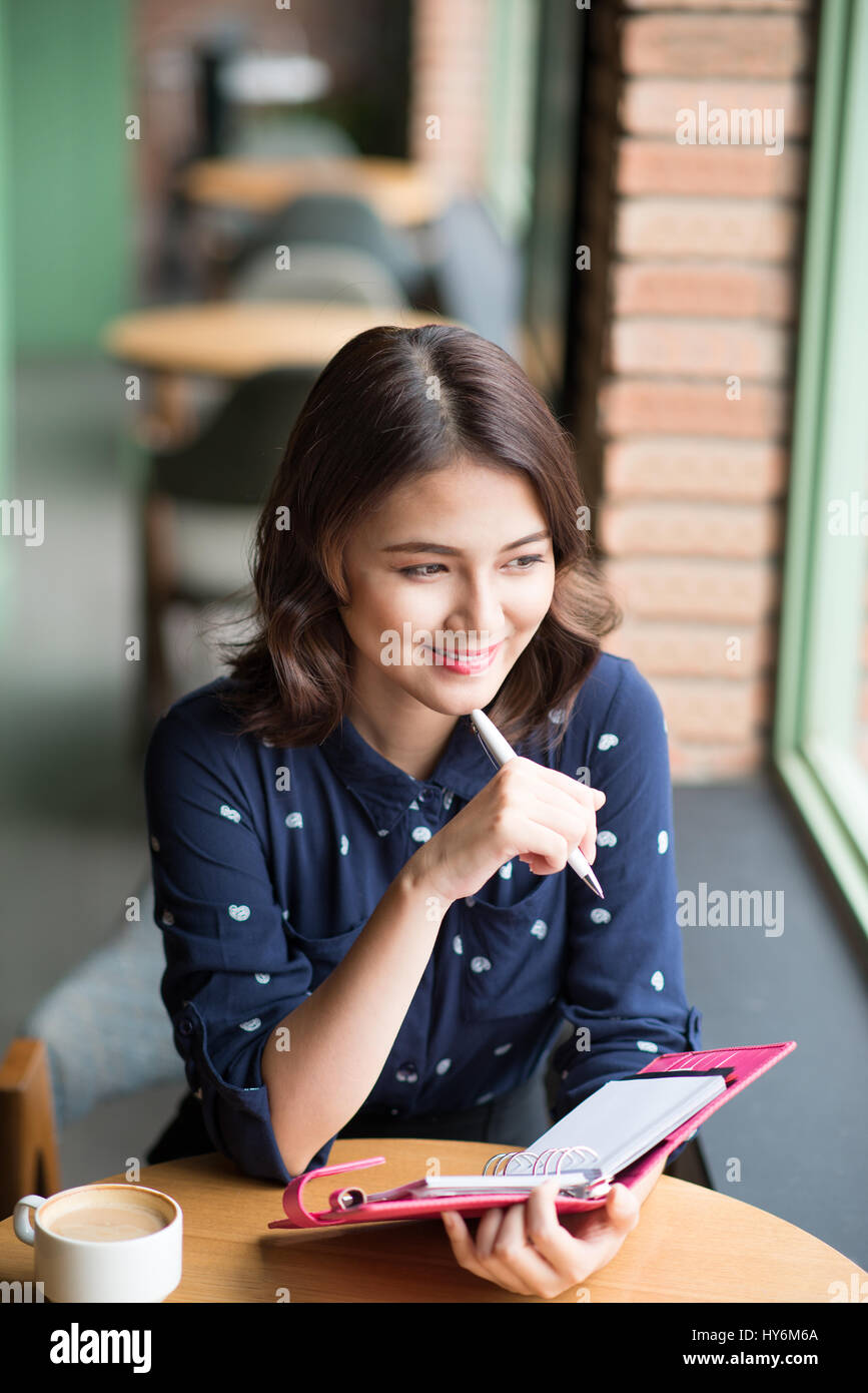 Asia business woman working planning concept in a cafe Stock Photo - Alamy
