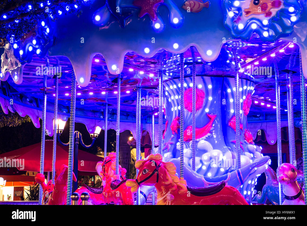 Night view of colorfully lit carousel Stock Photo - Alamy