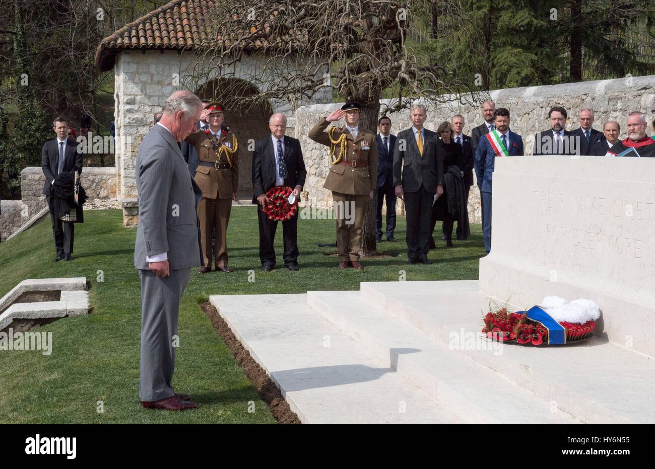 The Prince of Wales lays a wreath during a visit to the Commonwealth ...