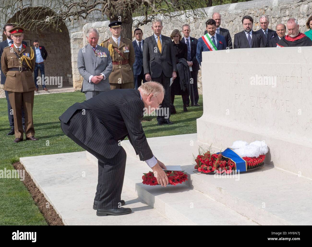 Robert Fox MBE, CWGC Commissioner lays a wreath during a visit with The ...
