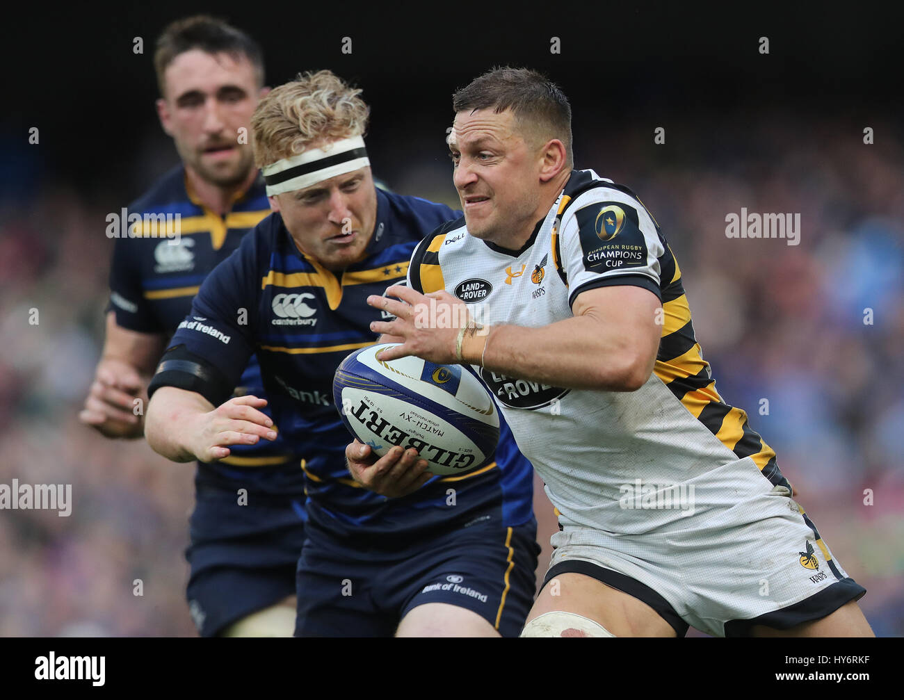 Wasps' Jimmy Gopperth goes past Leinster's James Tracy before scoring ...