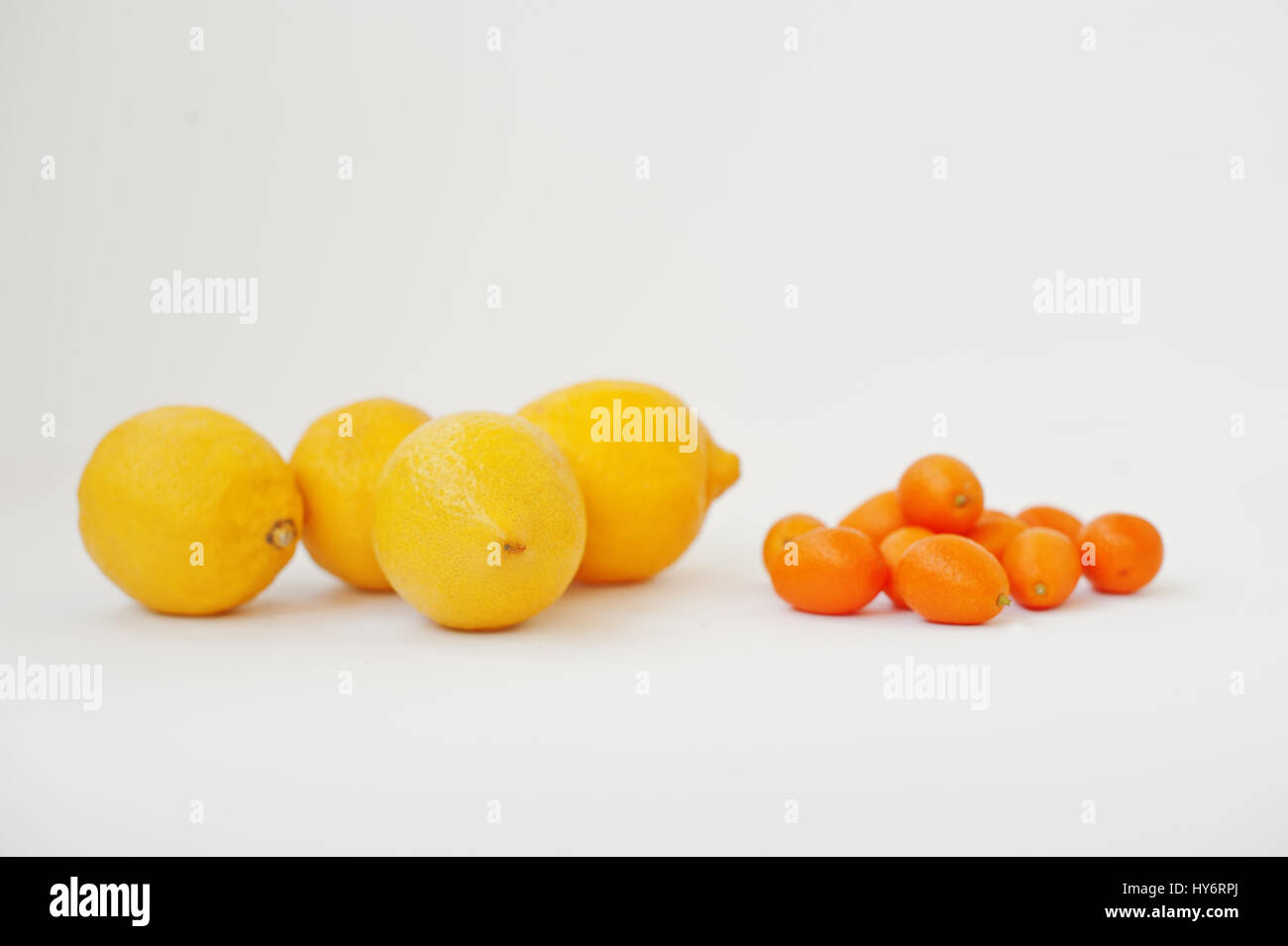 Exotic fruits kumquat with lemons isolated on white background. Healthy ...