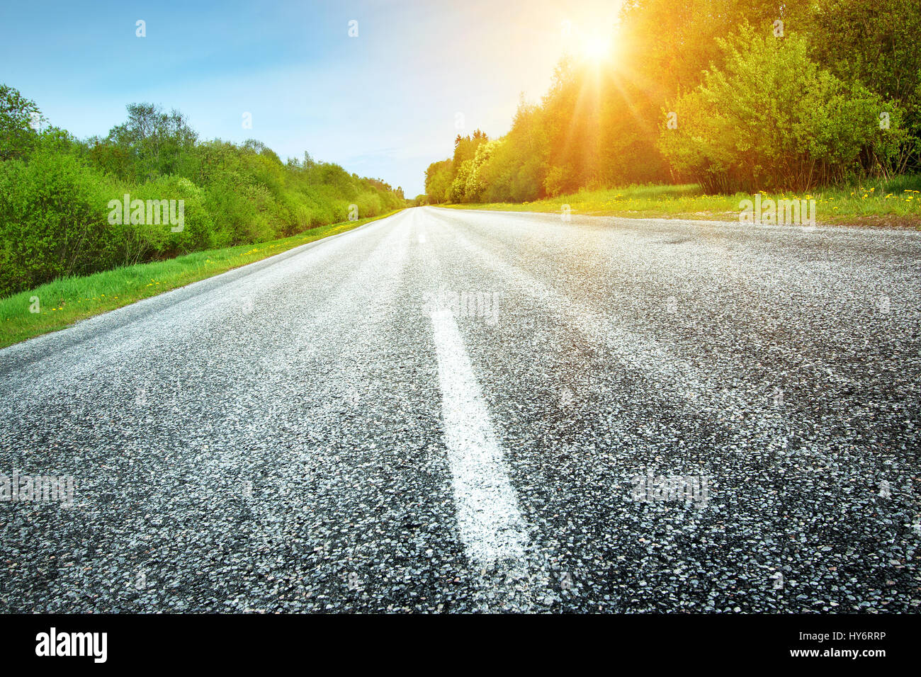 Road sun wide curve hi-res stock photography and images - Alamy