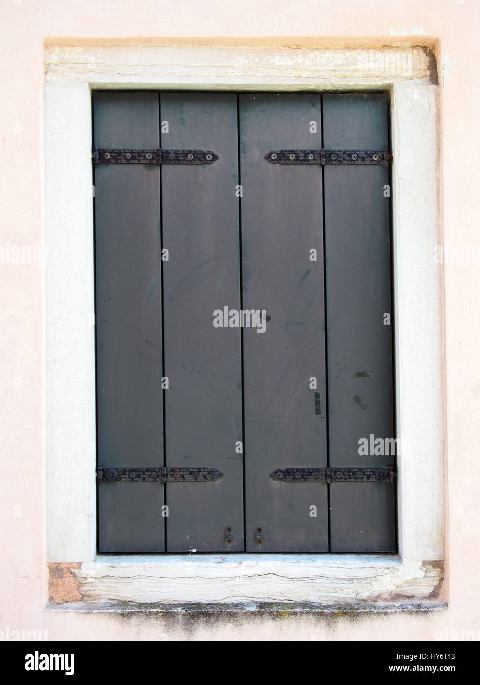 grey shuttered window with metal hinges in a white wall Stock Photo - Alamy