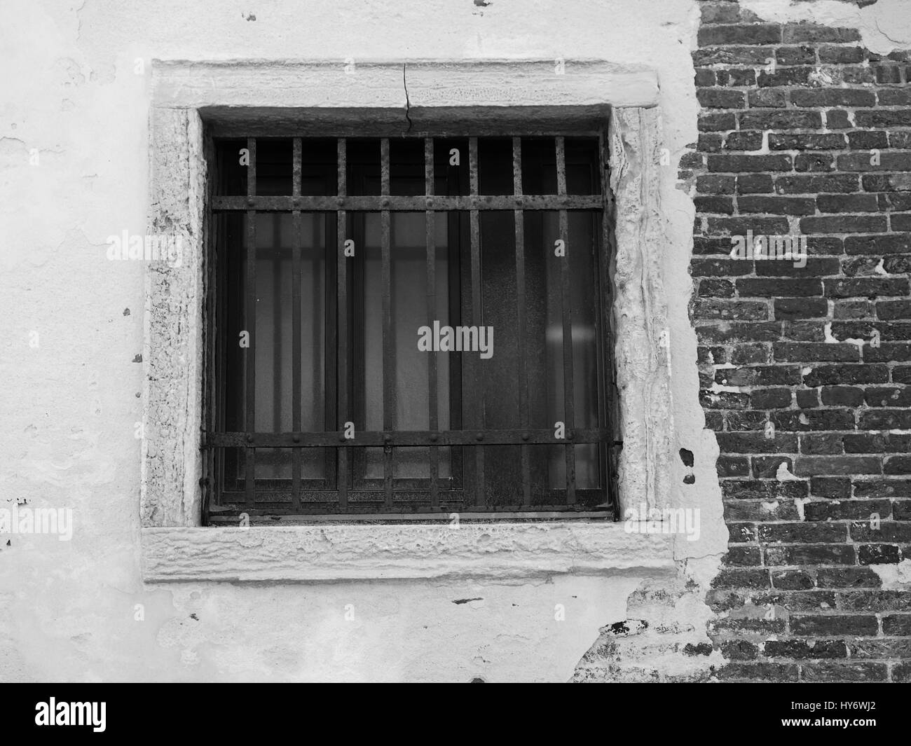 Old barred window on a distressed brick wall Stock Photo - Alamy