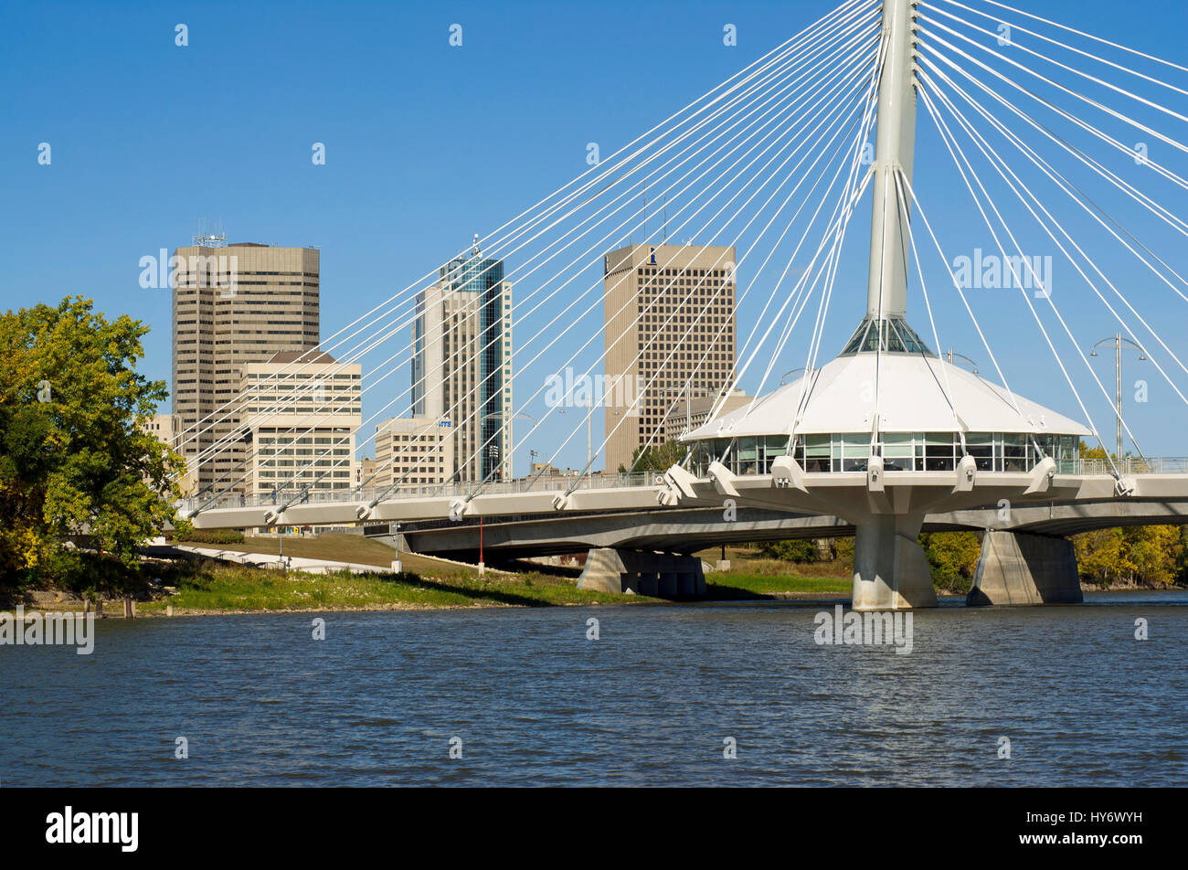 Esplanade Riel Pedestrian Bridge crossing the Red River and skyscrapers ...