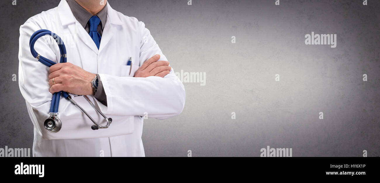 Doctor Man In Standing With Wall Background Stock Photo - Alamy