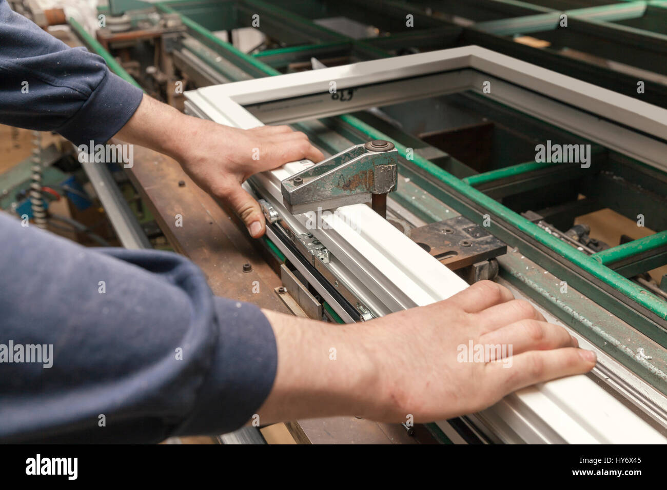 machine for assembly of plastic windows, close up Stock Photo - Alamy