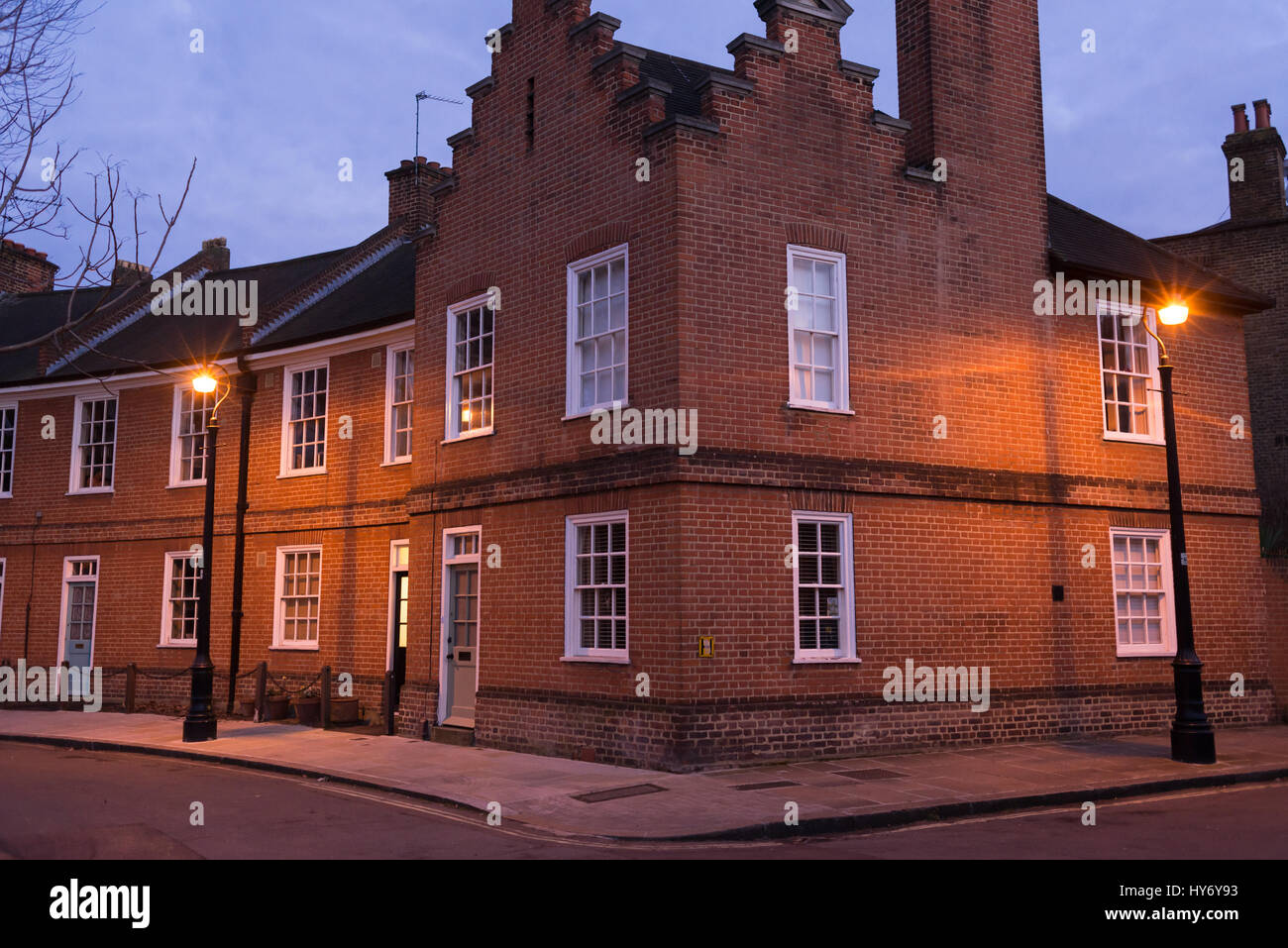 Restored Edwardian brick houses on a local road at night with street ...