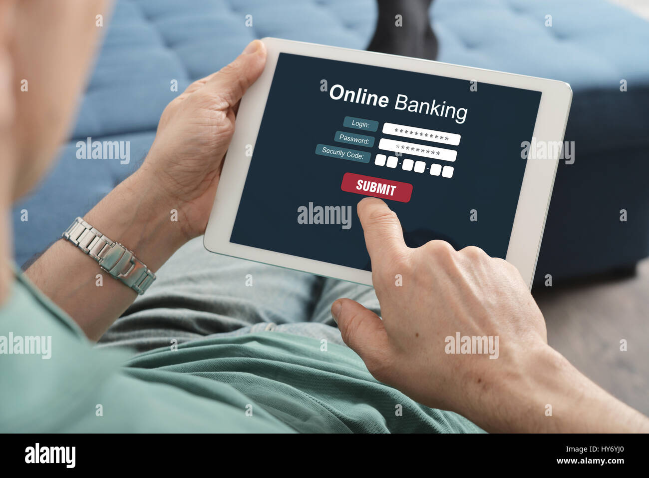 Male hands using online banking on touch screen device Stock Photo - Alamy