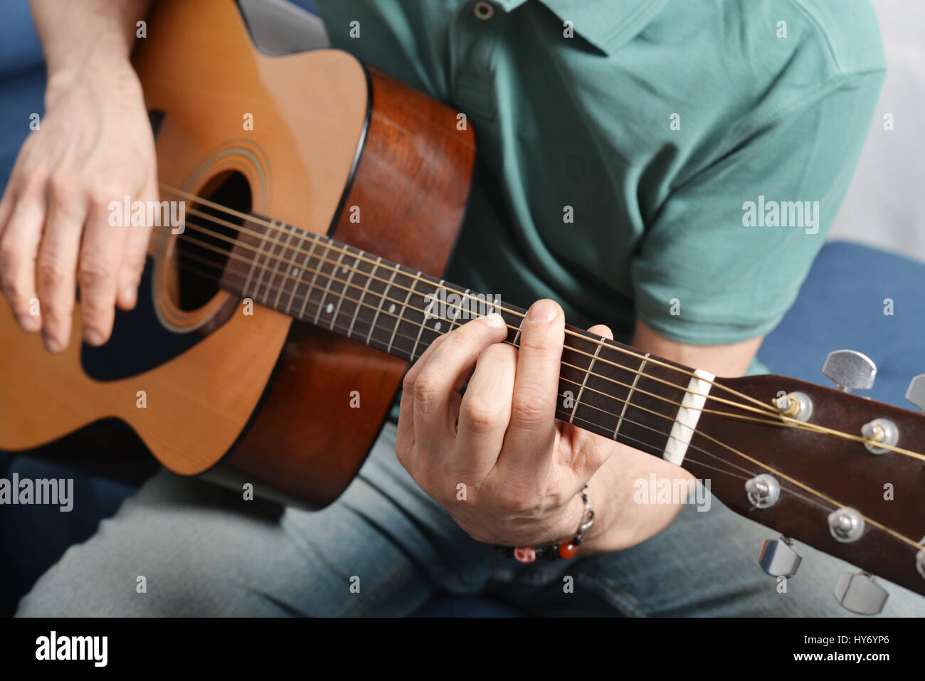 Closeup of fingers from playing acoustic guitar Stock Photo - Alamy