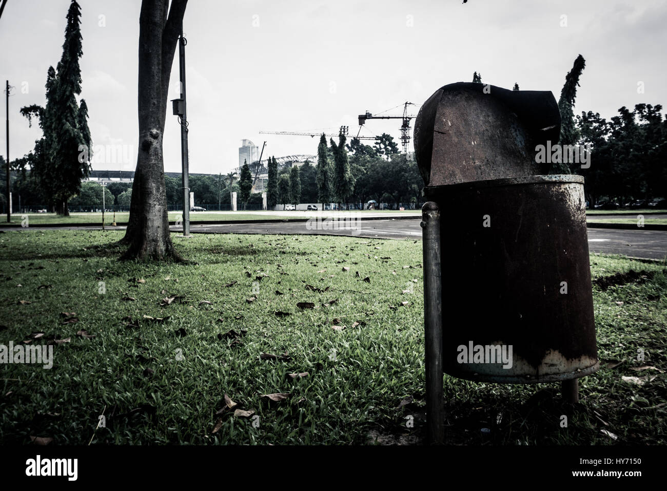 A rusty trash bin made from zinc in city park photo taken in Jakarta ...