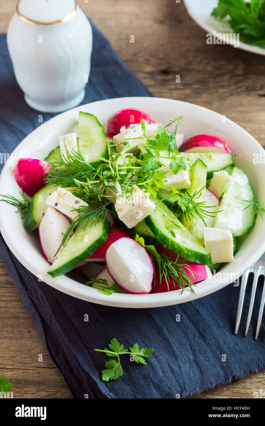 Spring vegetable salad with fresh cucumber, radishes, feta cheese ...