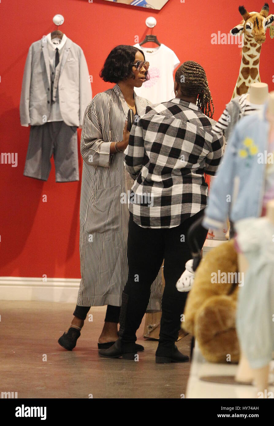 Kelly Rowland goes shopping for children's clothes with a friend at ...