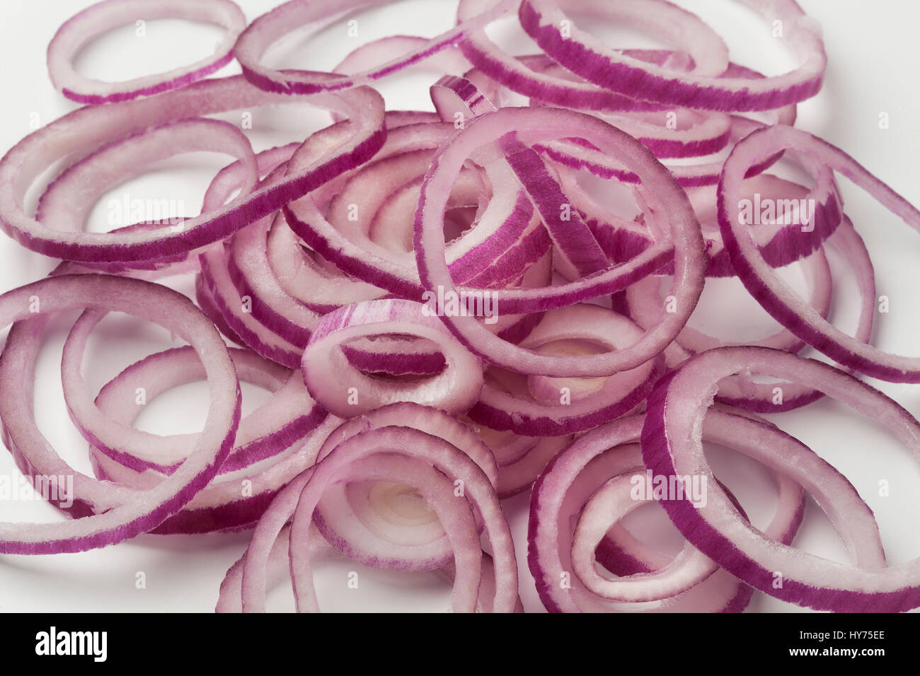 Fresh raw red onion rings on white background Stock Photo - Alamy