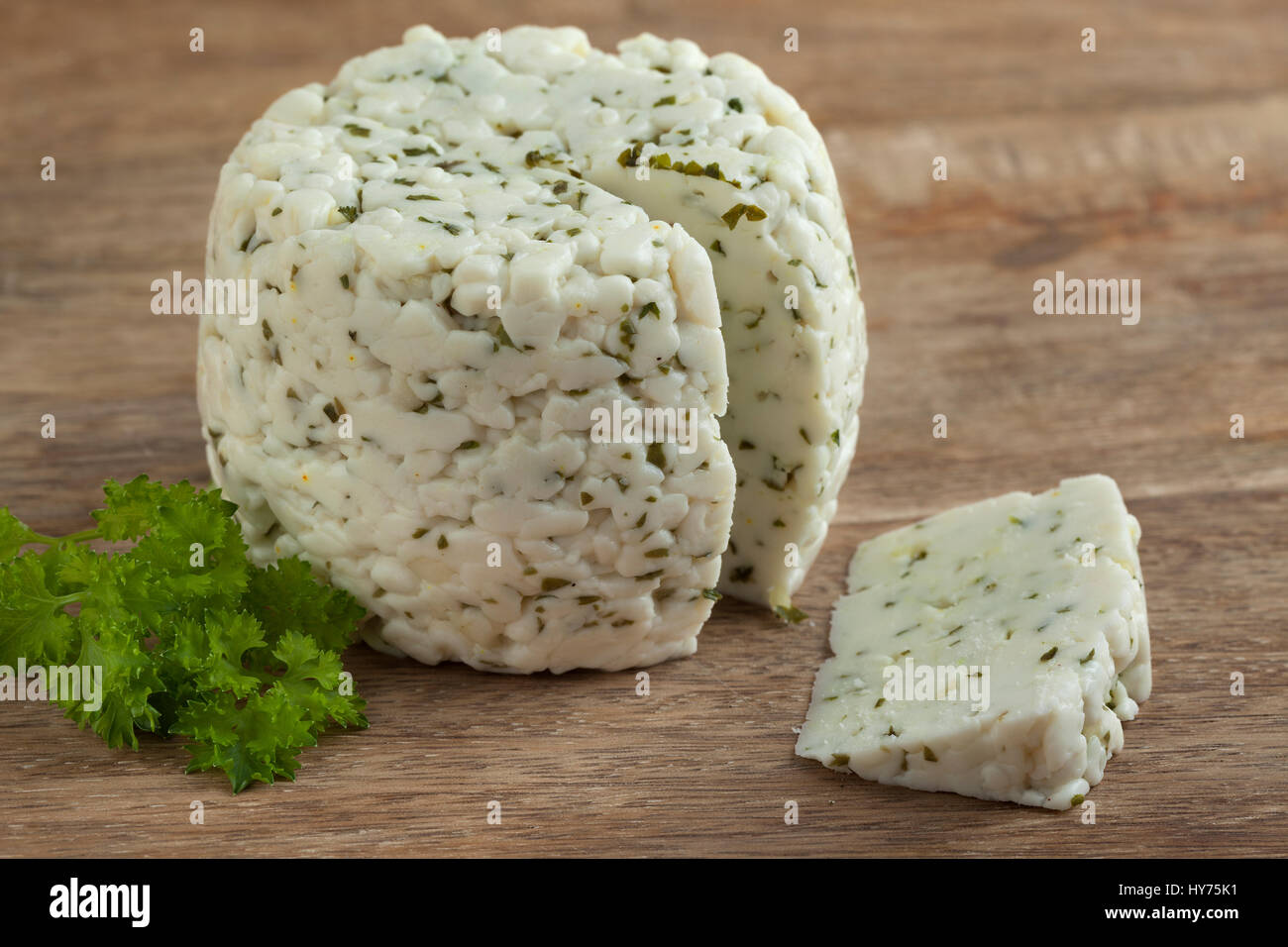 Fresh soft goats cheese with green herbs Stock Photo - Alamy