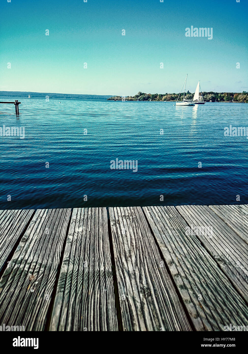 Wooden water jetty at lake as background Stock Photo - Alamy