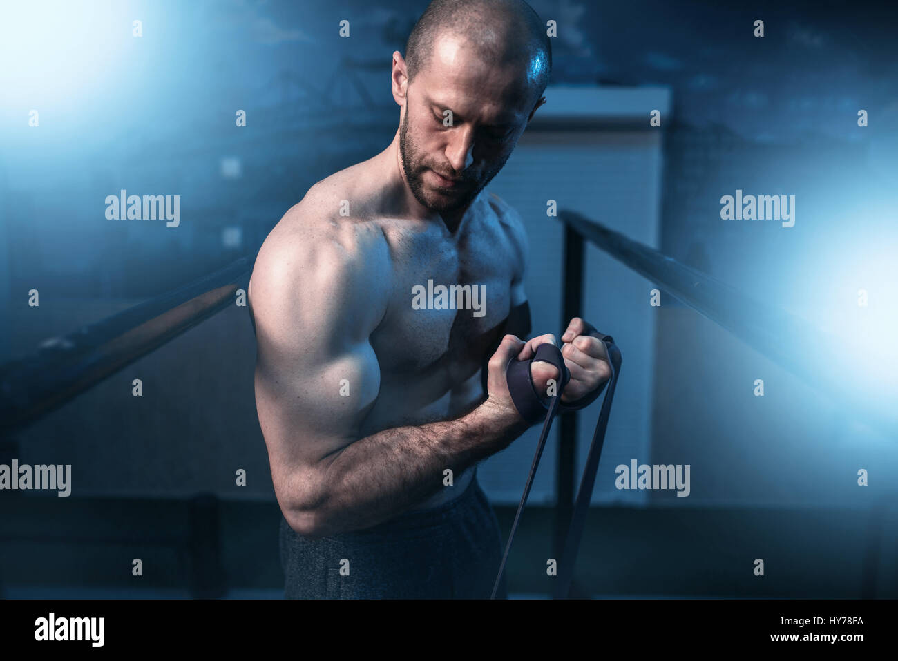 Muscle athlet exercises with elastic band. Active sport lifestyle ...