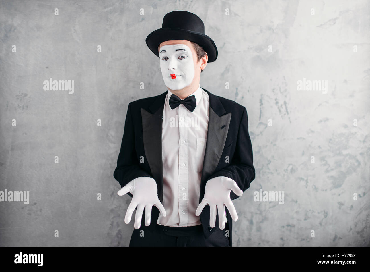 Funny male mime artist with makeup in gloves and hat. April fools day ...