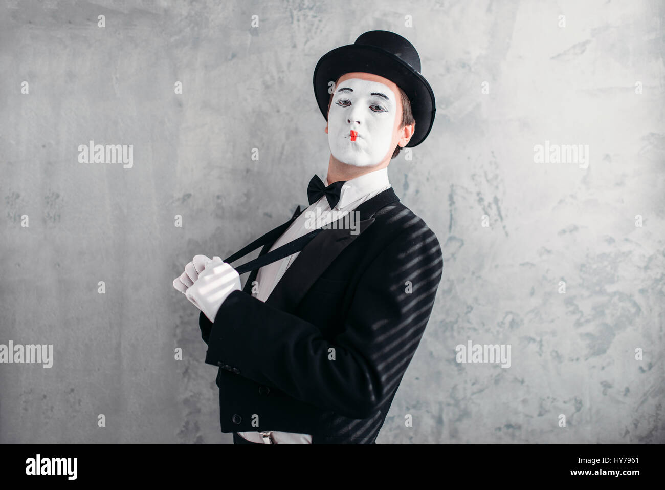 Mime male artist with white makeup mask. Comedy actor in suit, gloves ...