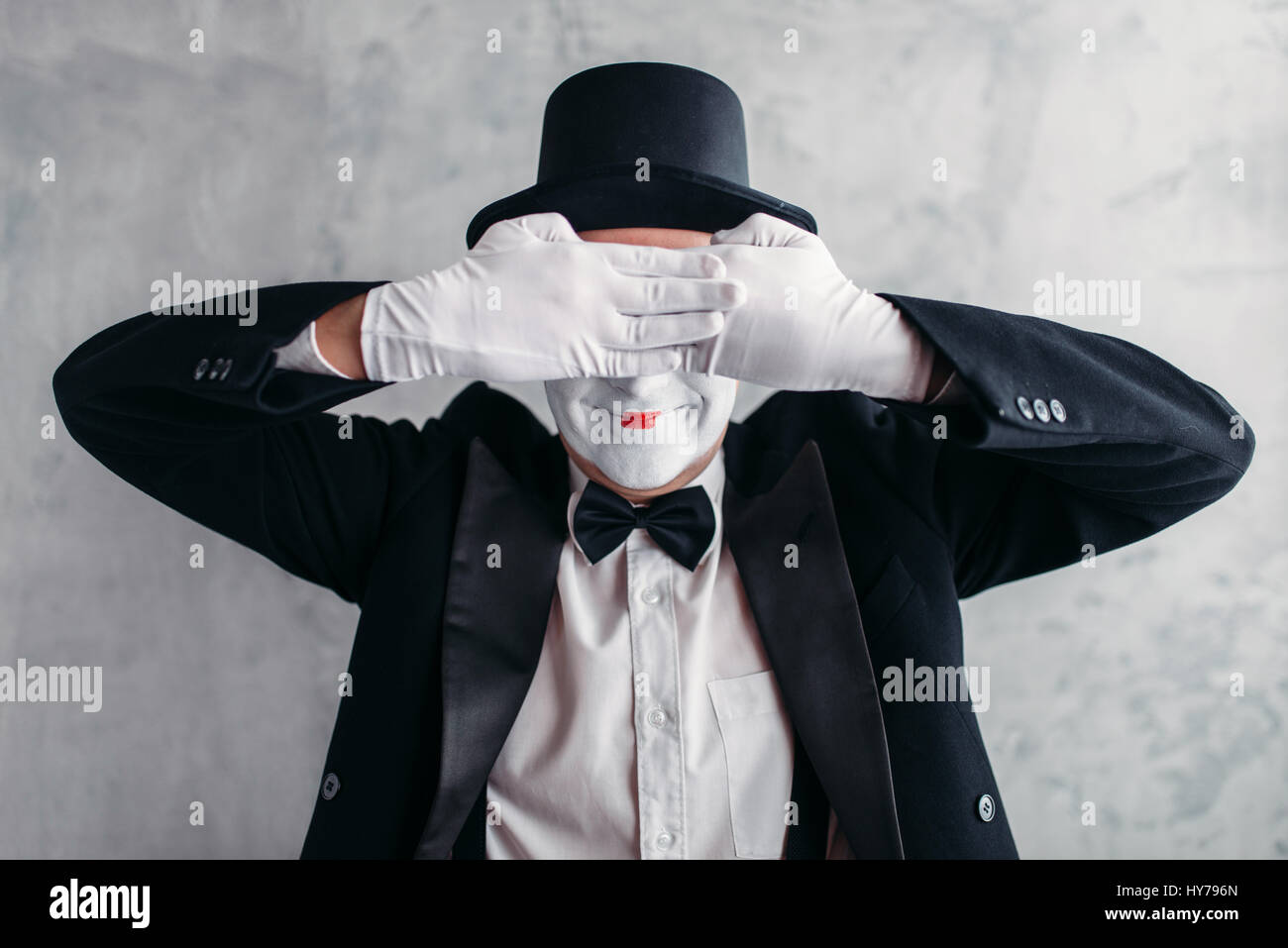 Circus artist posing, pantomime with white makeup mask. Comedy actor in ...