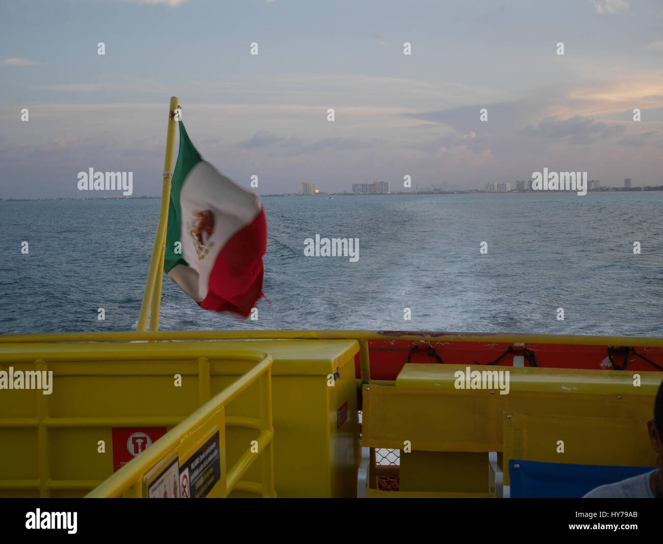 Mexican flag in the boat on the ocean Stock Photo - Alamy