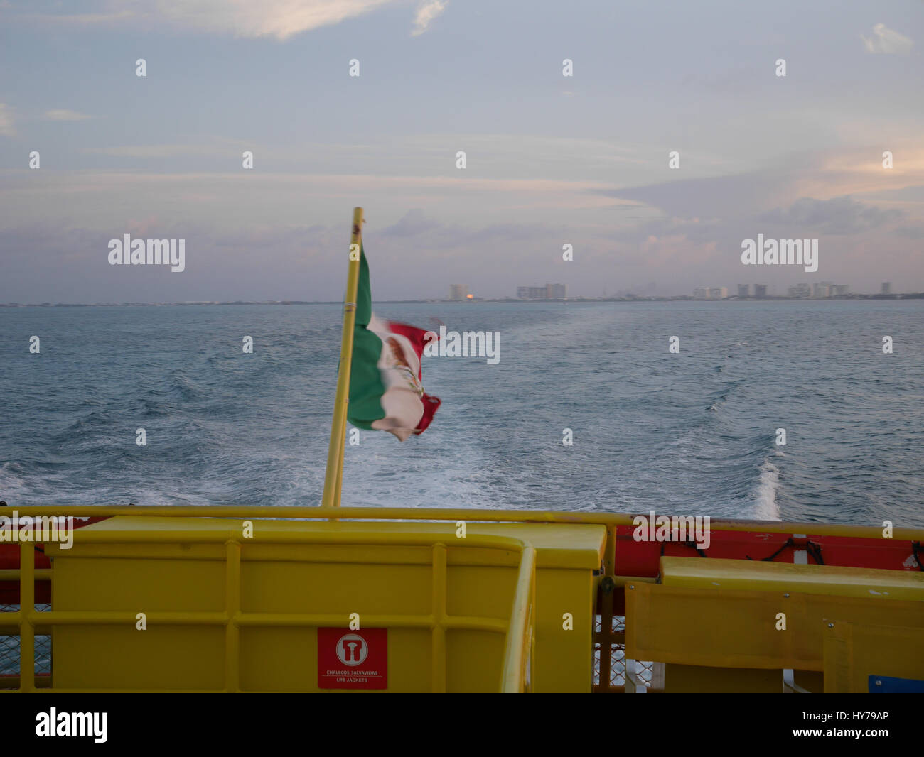 Mexican flag in the boat on the ocean Stock Photo - Alamy