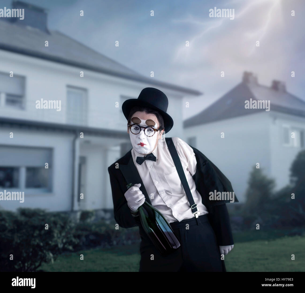 Mime actor with big bottle of alcohol performing a drunk man. Comedy ...