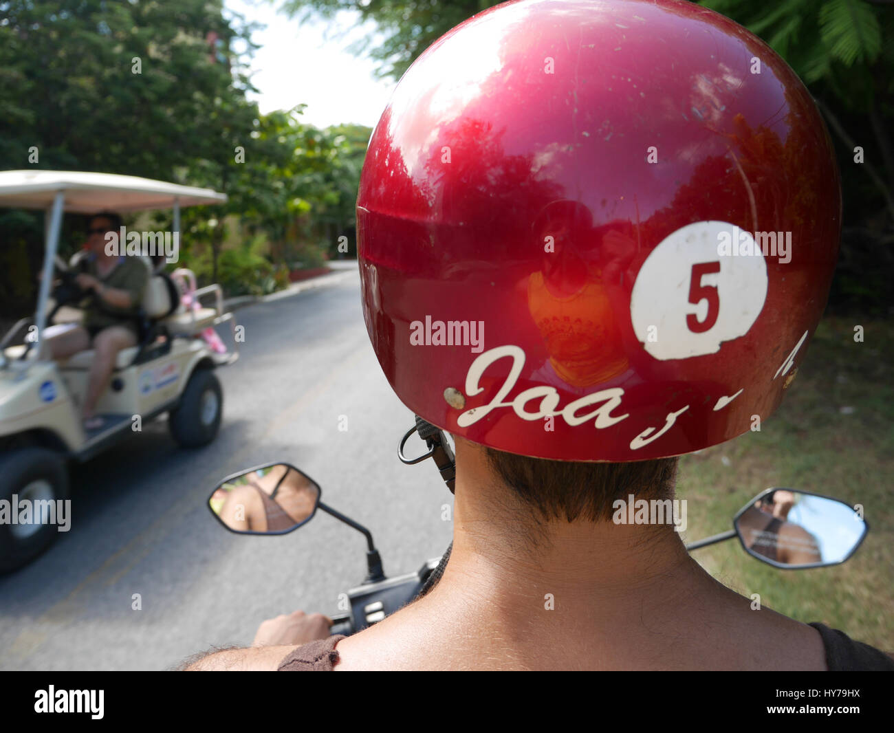 Red helmet scooter driver Stock Photo - Alamy