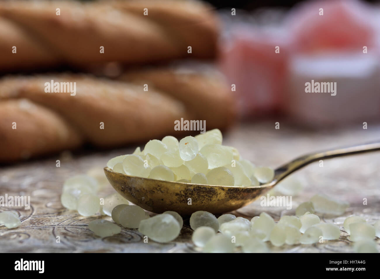 Chios mastic tears in a spoon on a silver background Stock Photo - Alamy